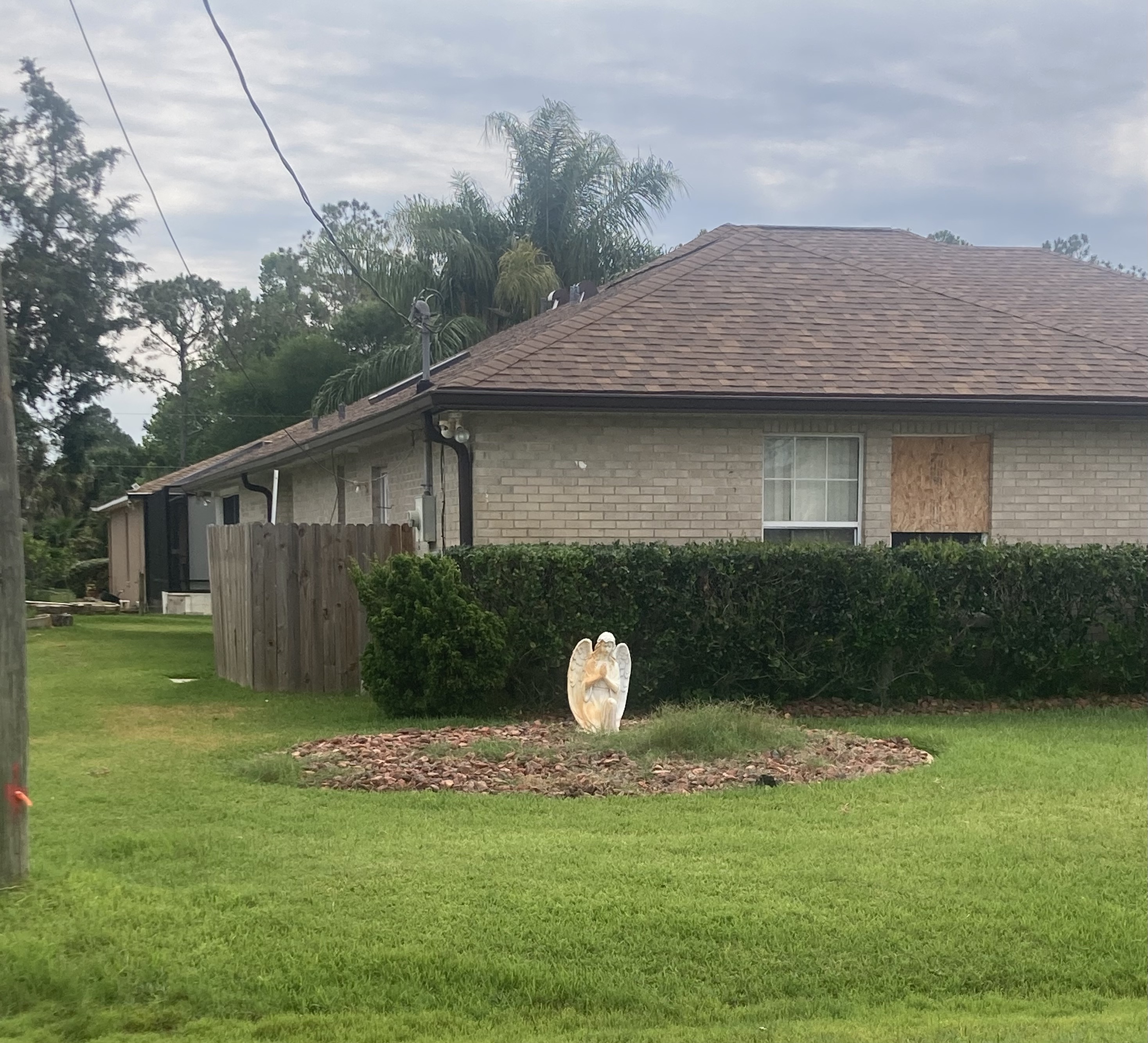 A front yard angel takes a knee – Waite for it…